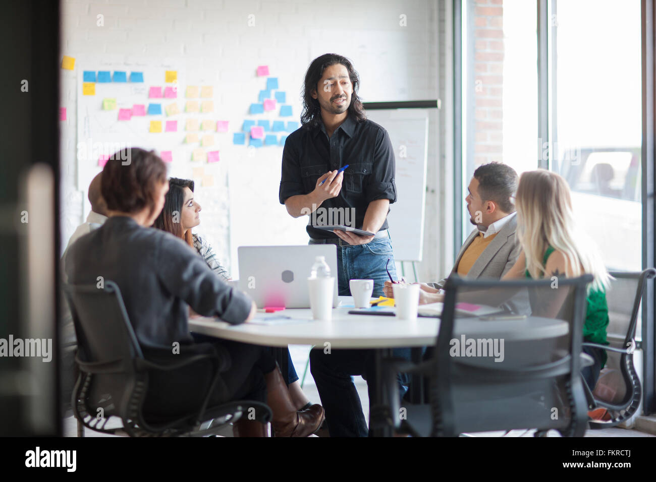Business people talking in office meeting Stock Photo - Alamy