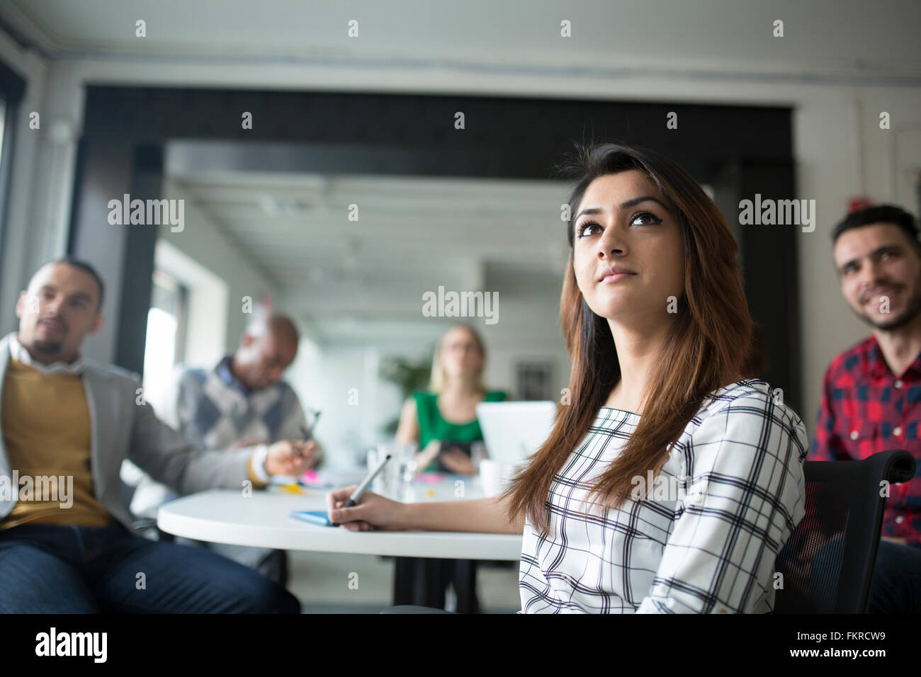 Business people listening in office meeting Stock Photo - Alamy