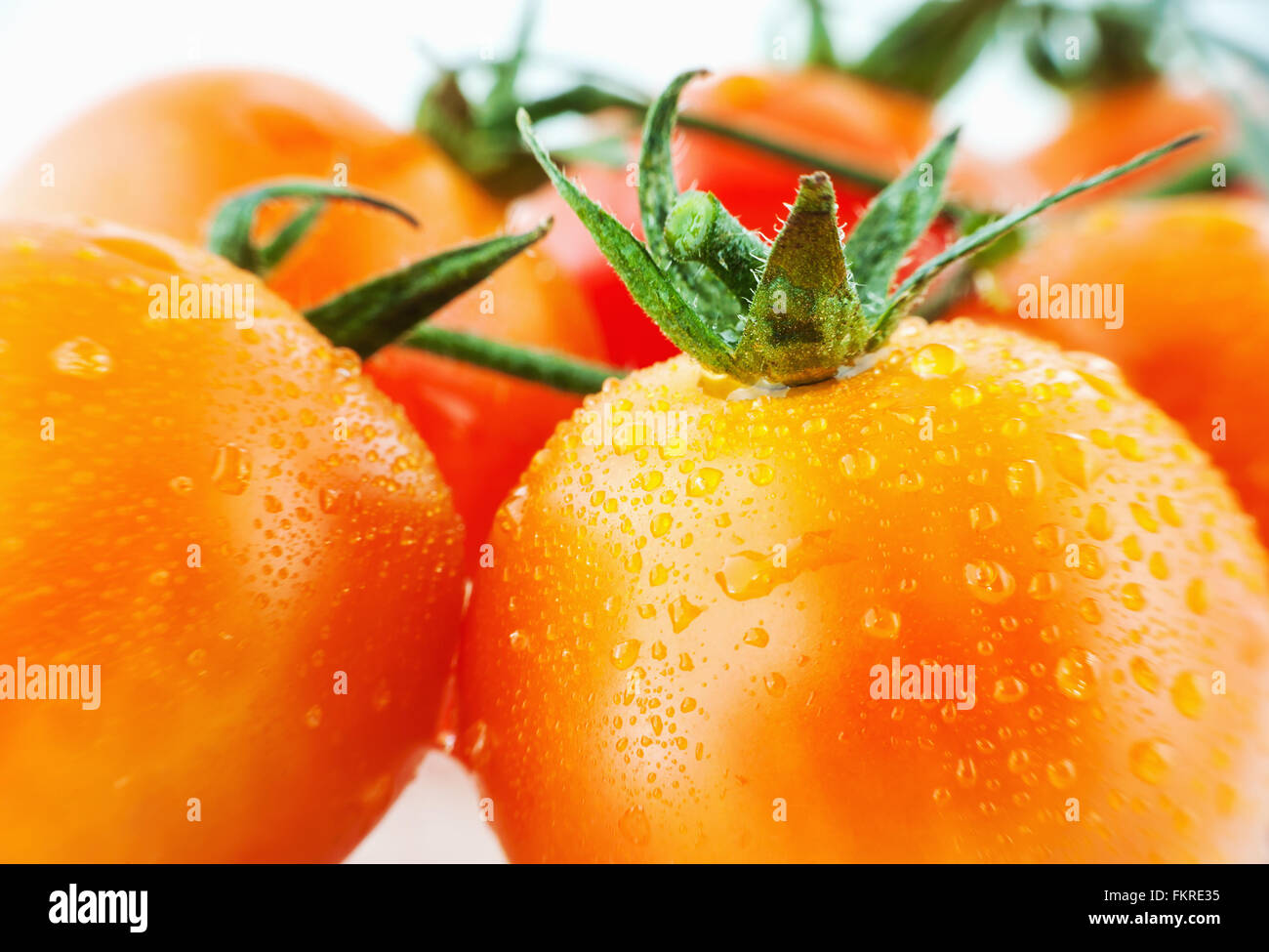 Macro fresh tomato and bubble on white background Stock Photo - Alamy