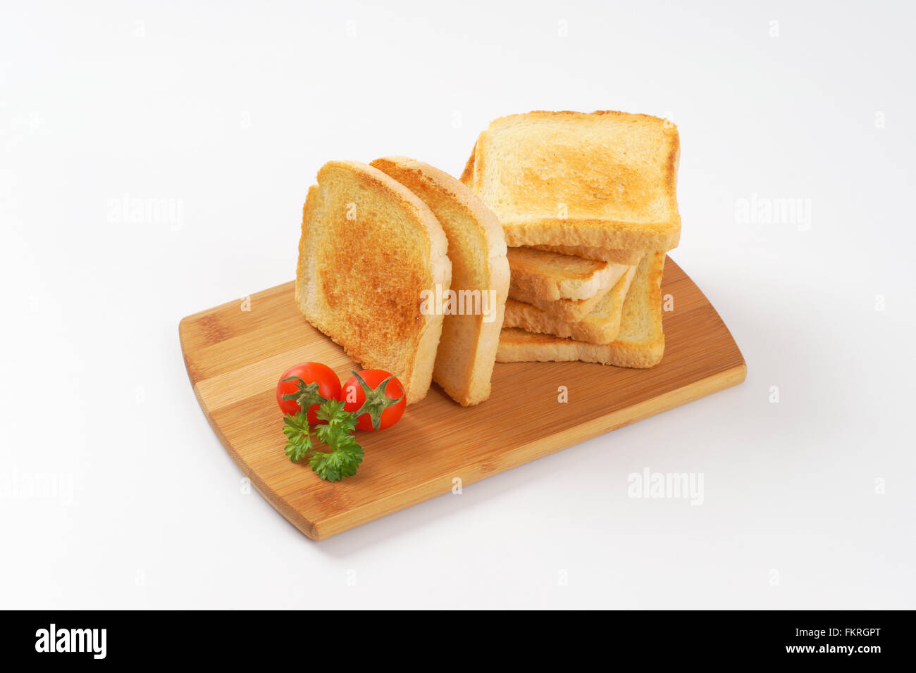 freshly made toasts on wooden cutting board Stock Photo - Alamy