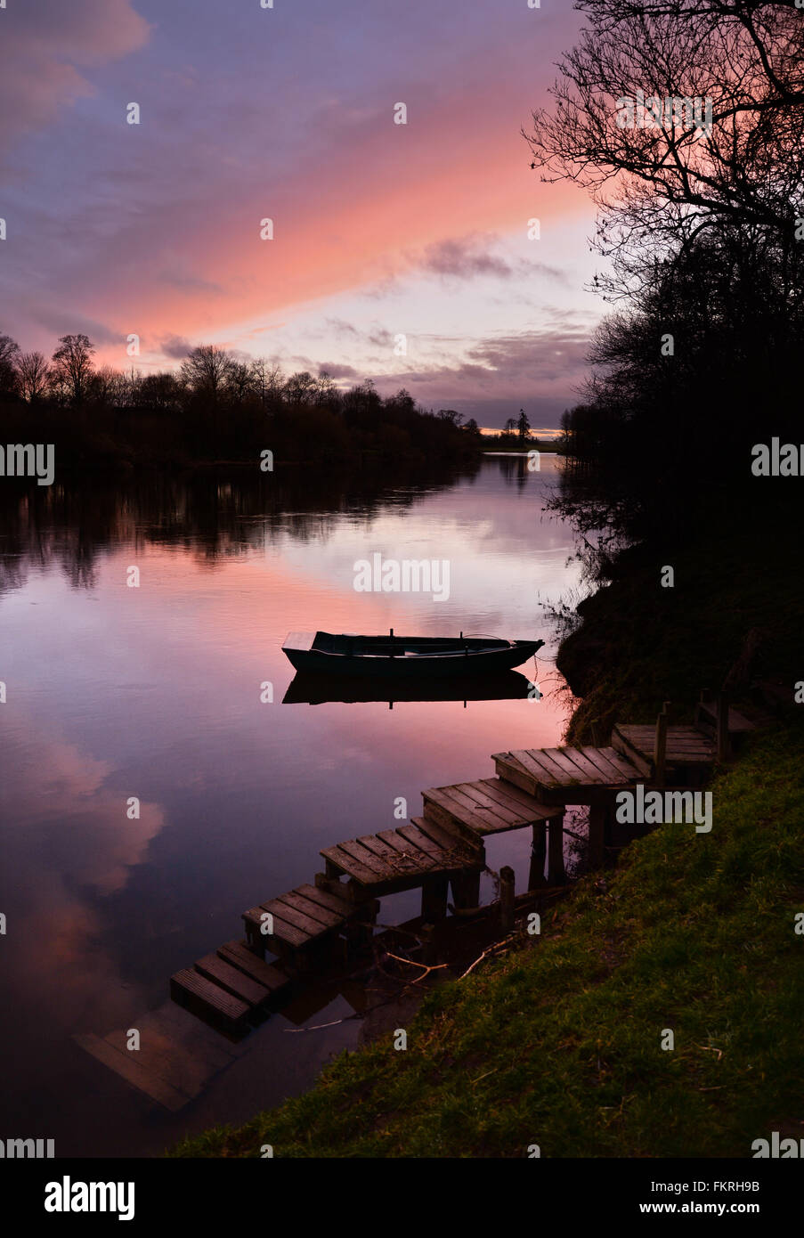 Angling boat on the River Tweed near Birgham where the river forms the ...