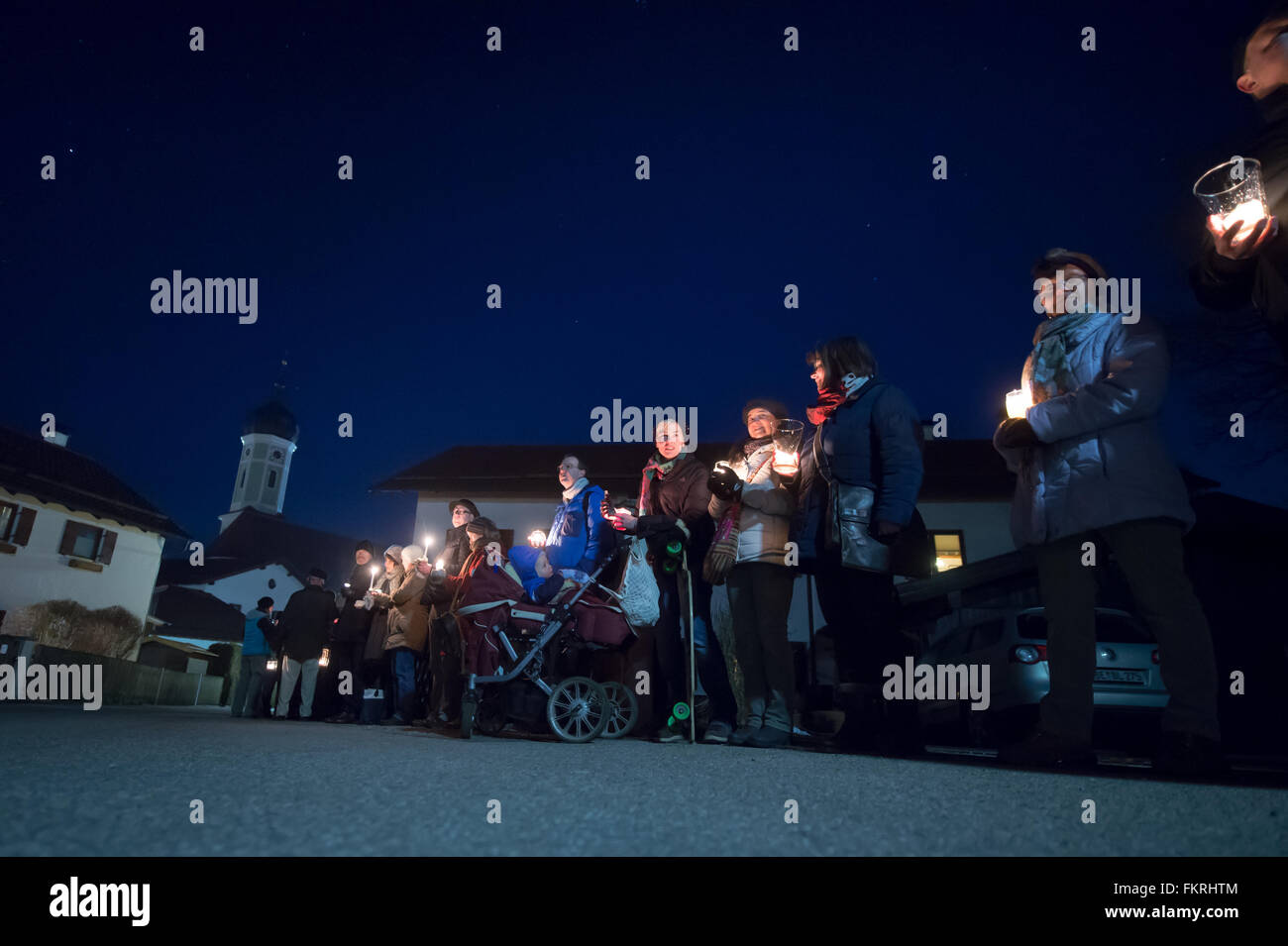 Zorneding, Germany. 09th Mar, 2016. People form a chain of lights along ...