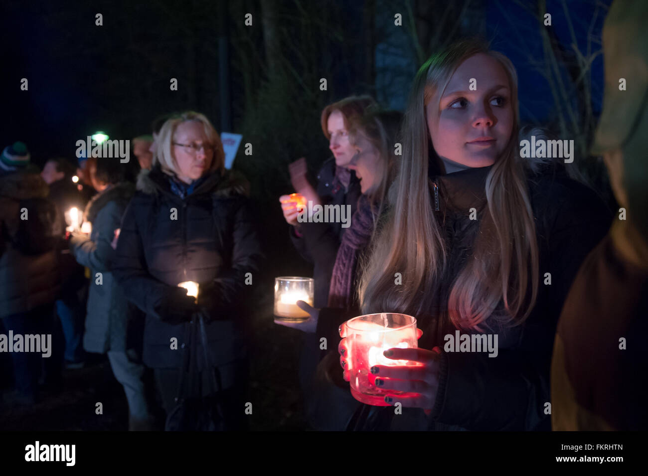 Zorneding, Germany. 09th Mar, 2016. People form a chain of lights along ...