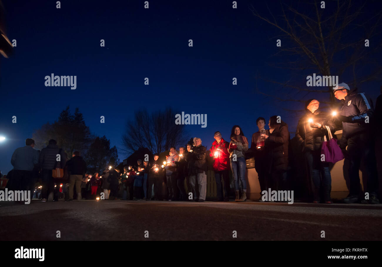 Zorneding, Germany. 09th Mar, 2016. People form a chain of lights along ...