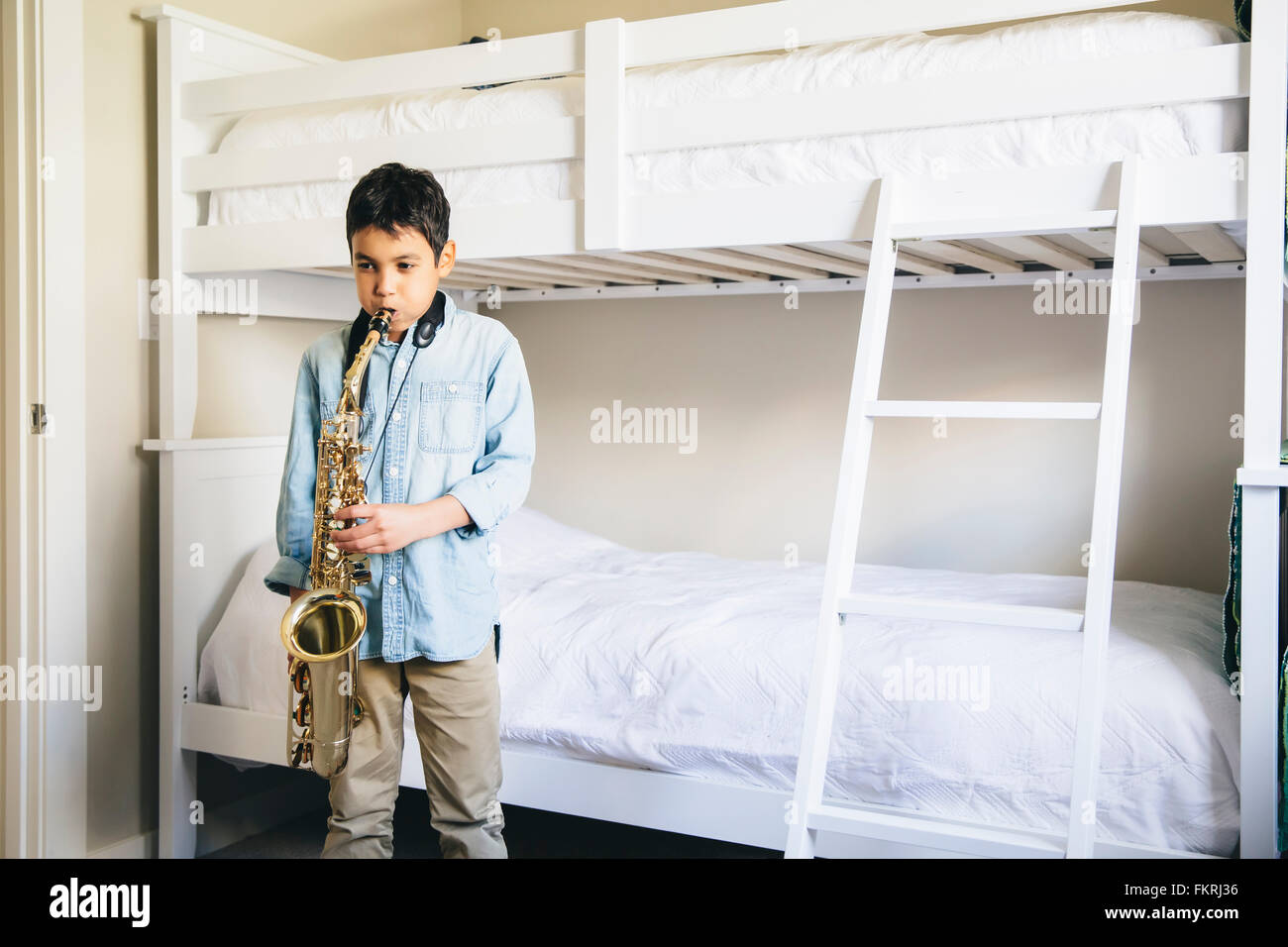 Children playing saxophone hi-res stock photography and images - Alamy