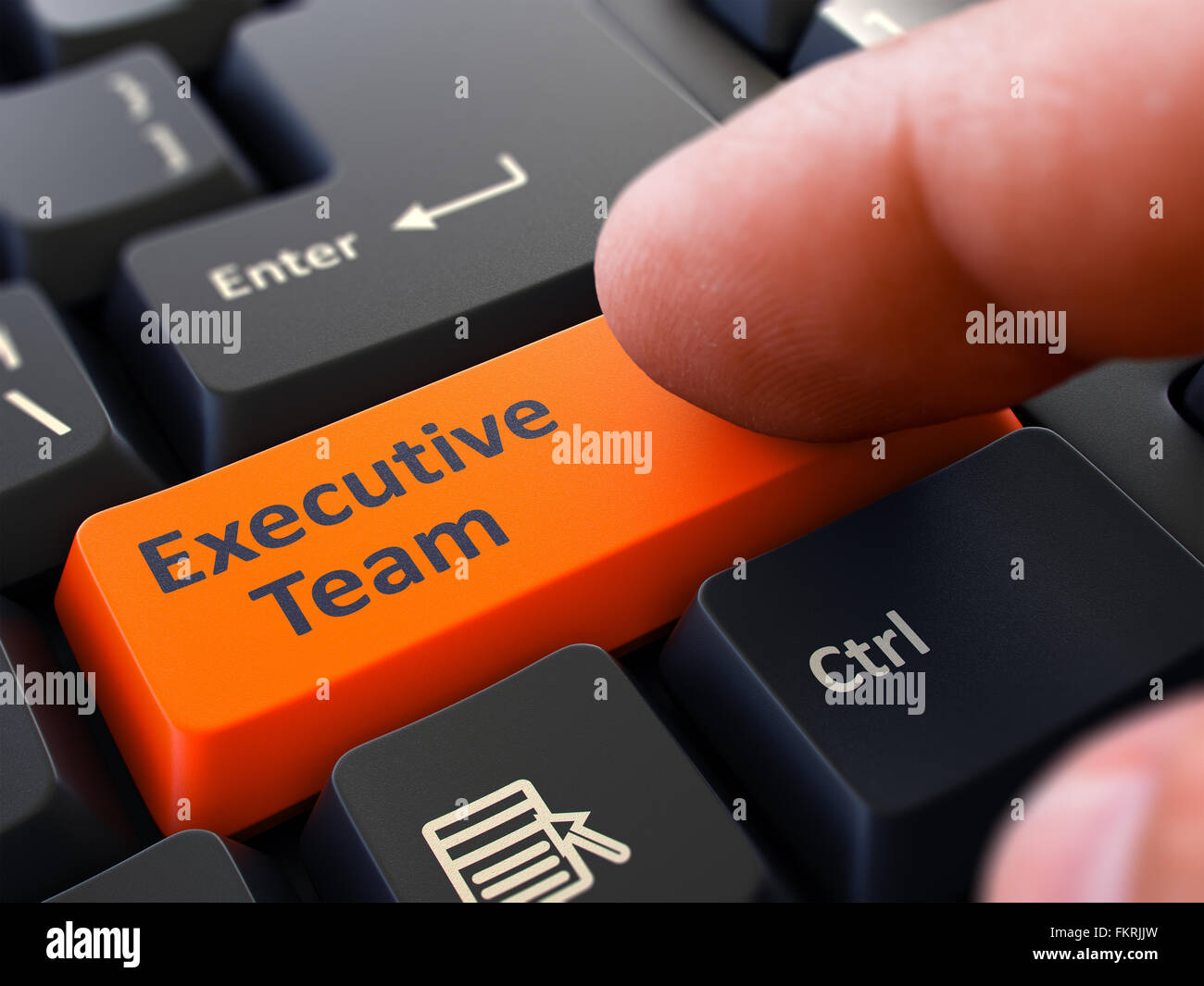 Executive Team - Clicking Orange Keyboard Button Stock Photo - Alamy