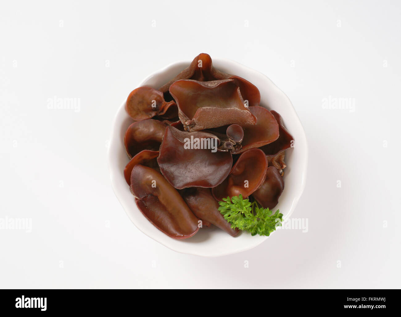 bowl of cooked ear mushrooms on white background Stock Photo - Alamy