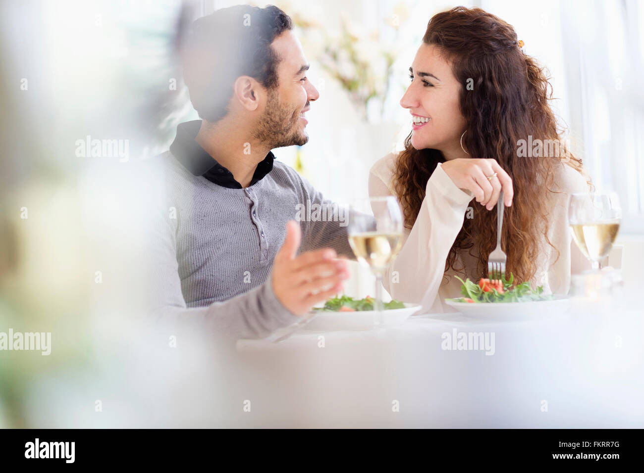 Couple sitting side by side at table hi-res stock photography and ...