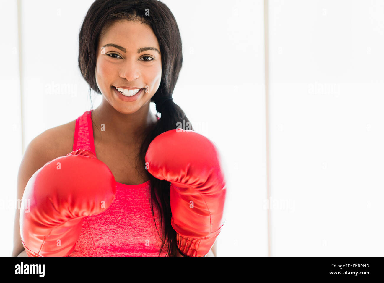 Mixed race boxer wearing boxing gloves Stock Photo - Alamy