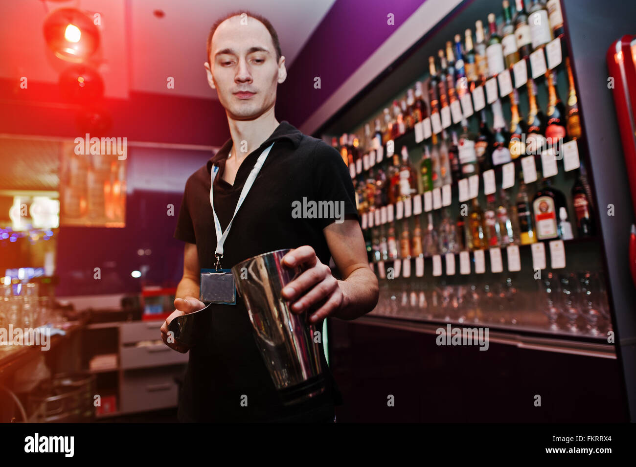 Young man bartender trick shaker hi-res stock photography and images ...