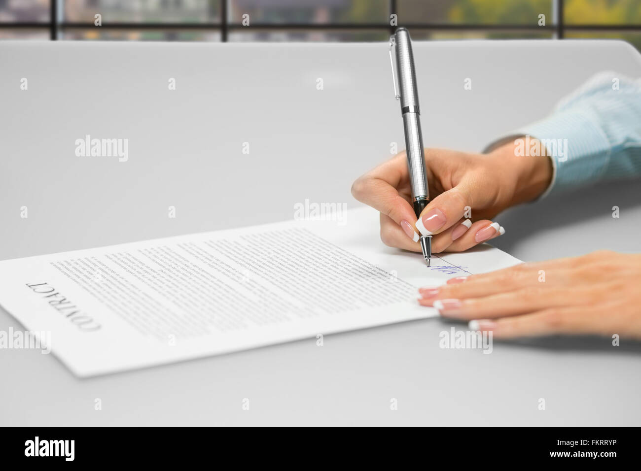 Woman's hands signing office papers Stock Photo - Alamy