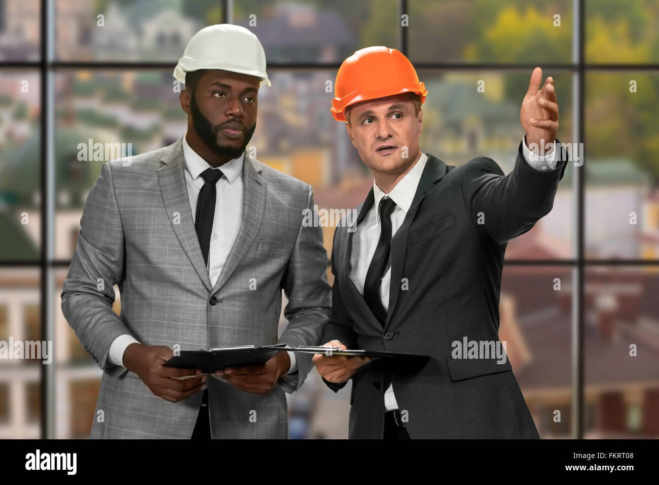 Two construction managers' daytime meeting Stock Photo - Alamy