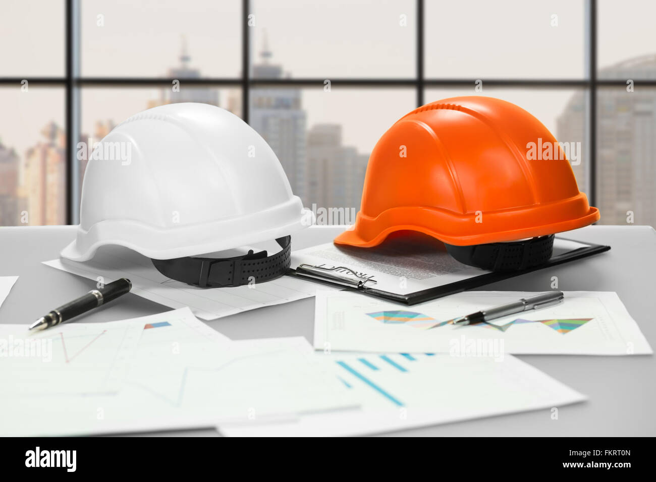 Foreman's table on city background Stock Photo - Alamy