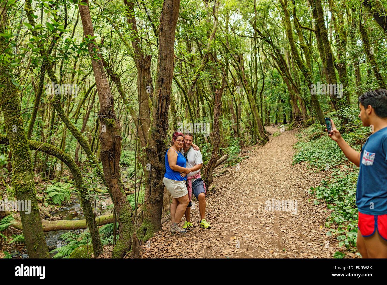 Hikers taking photos. Garajonay National Park is covered by dense ...