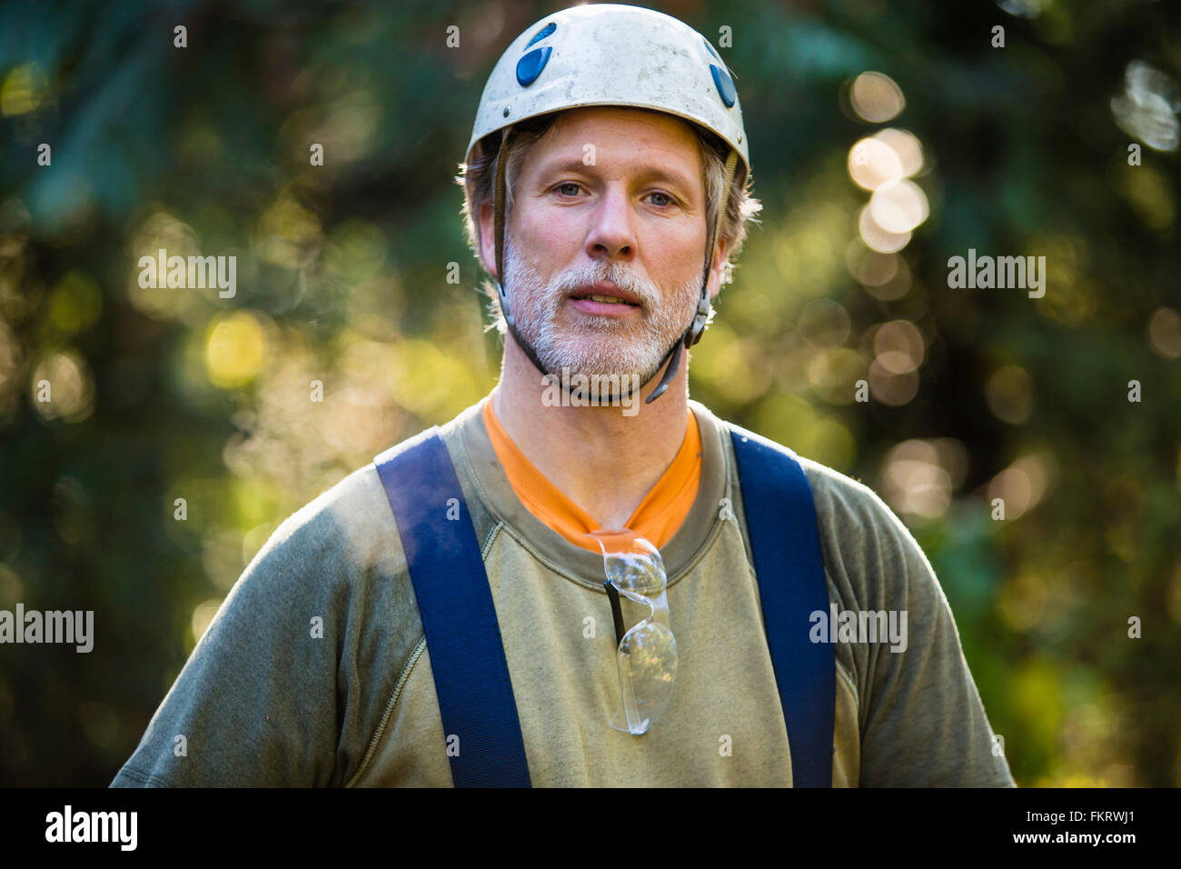 Logger wearing hat and suspenders outdoors Stock Photo - Alamy