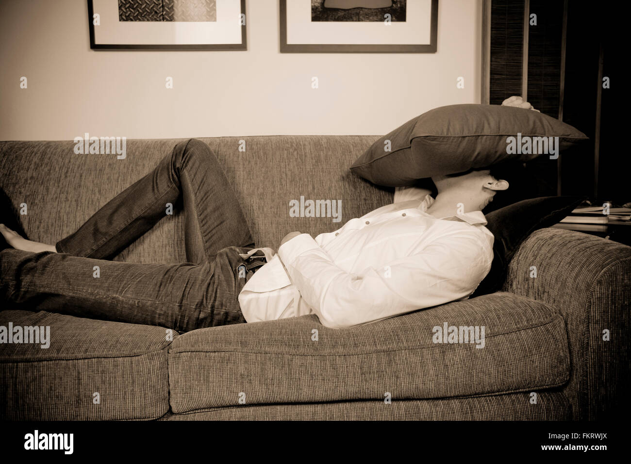 Man laying couch hi-res stock photography and images - Alamy