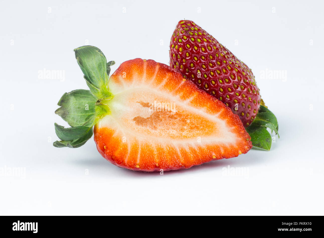 Half of strawberry isolated on white background Stock Photo - Alamy
