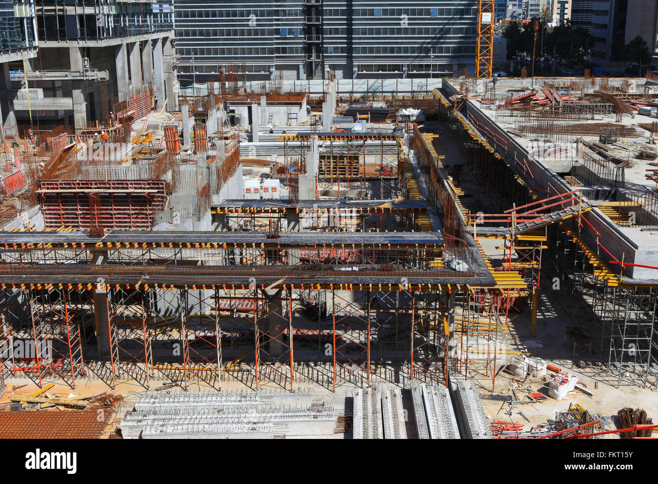 New skyscraper Construction site with workers at the business center of ...
