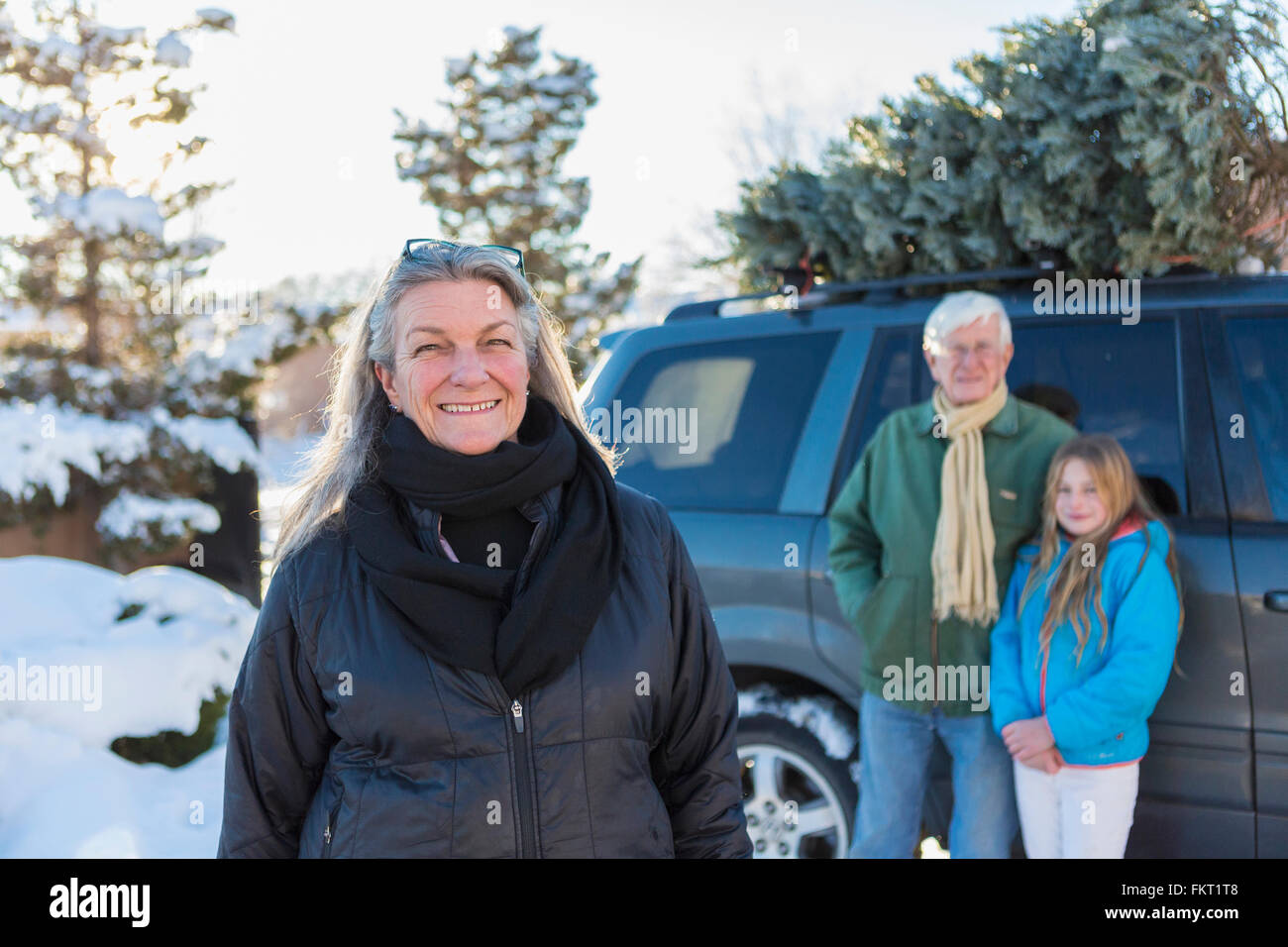 Posing by christmas tree hi-res stock photography and images - Alamy