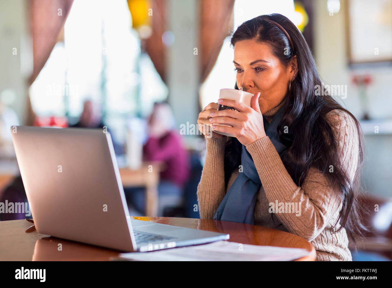 Woman using laptop in new hi-res stock photography and images - Alamy