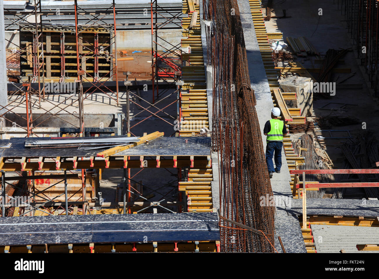 New skyscraper Construction site with workers at the business center of ...