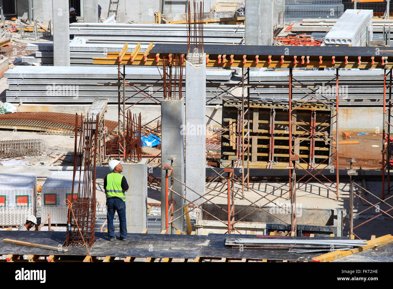 New skyscraper Construction site with workers at the business center of ...