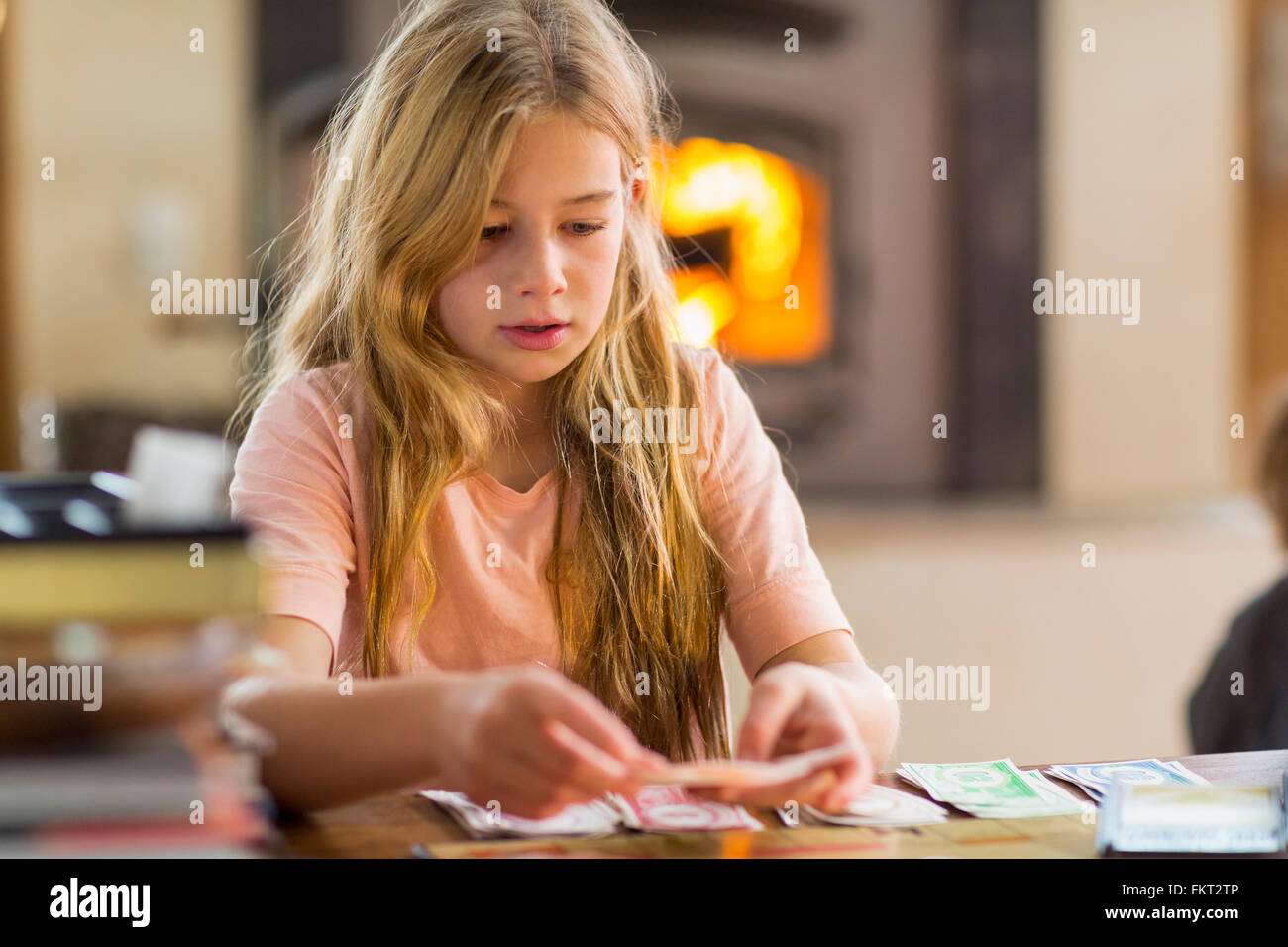 Caucasian girl playing cards Stock Photo - Alamy