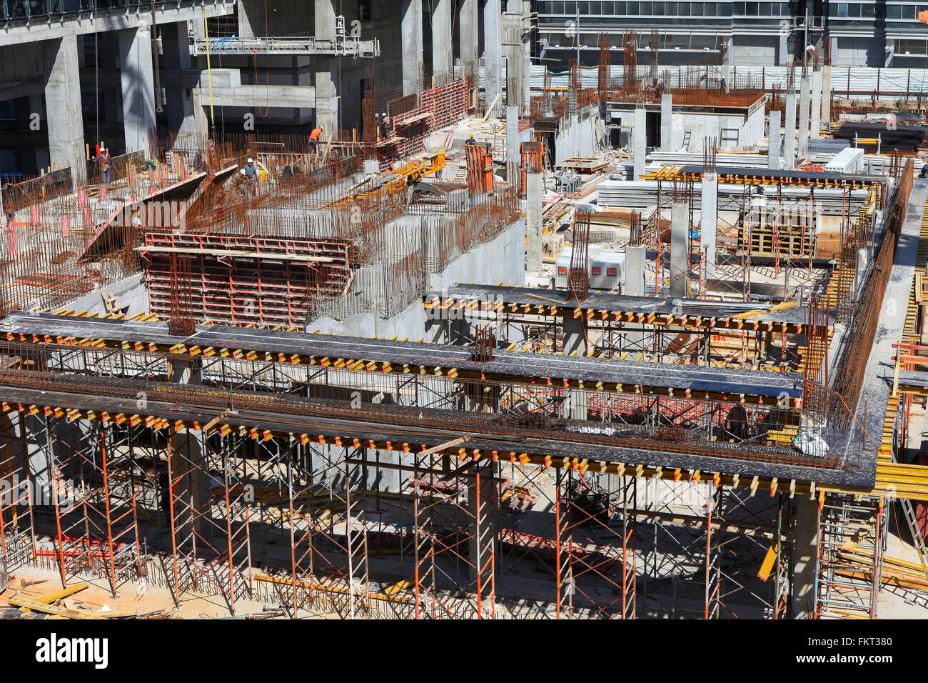 New skyscraper Construction site with workers at the business center of ...