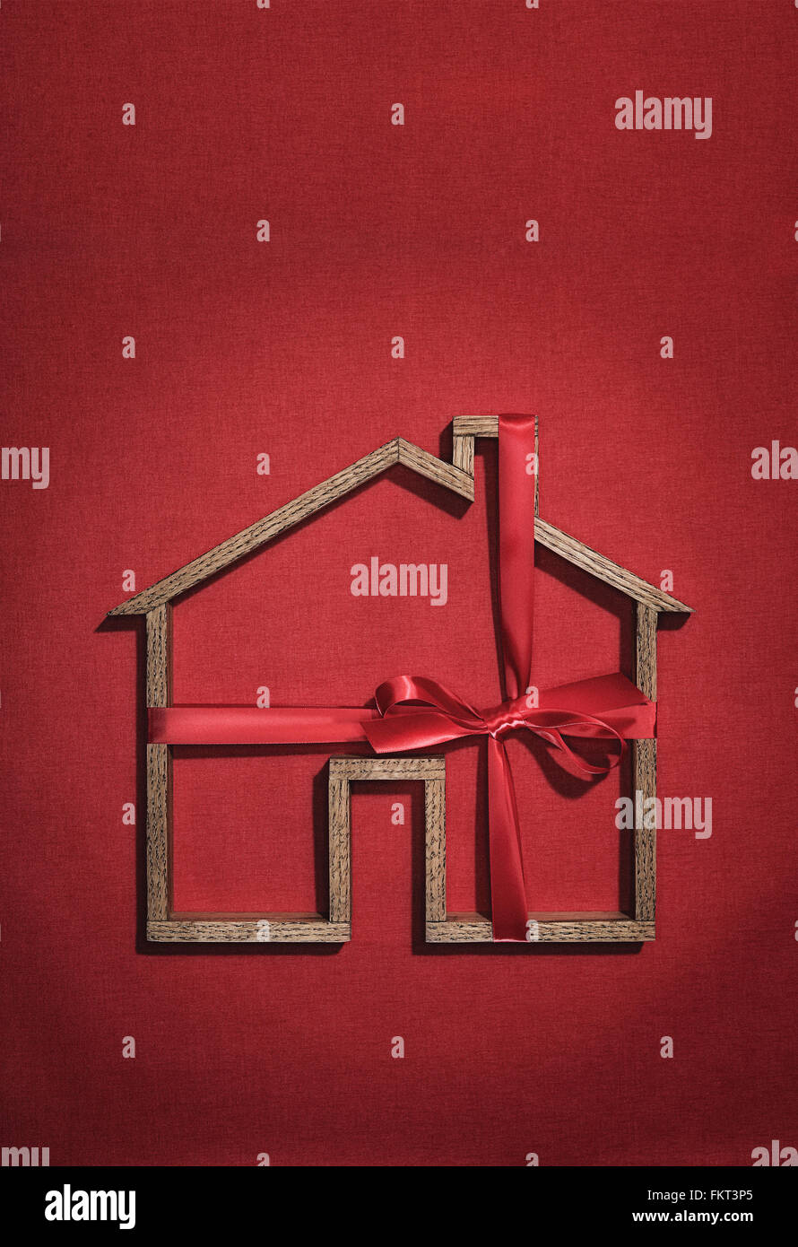 House shape wrapped in ribbon Stock Photo - Alamy