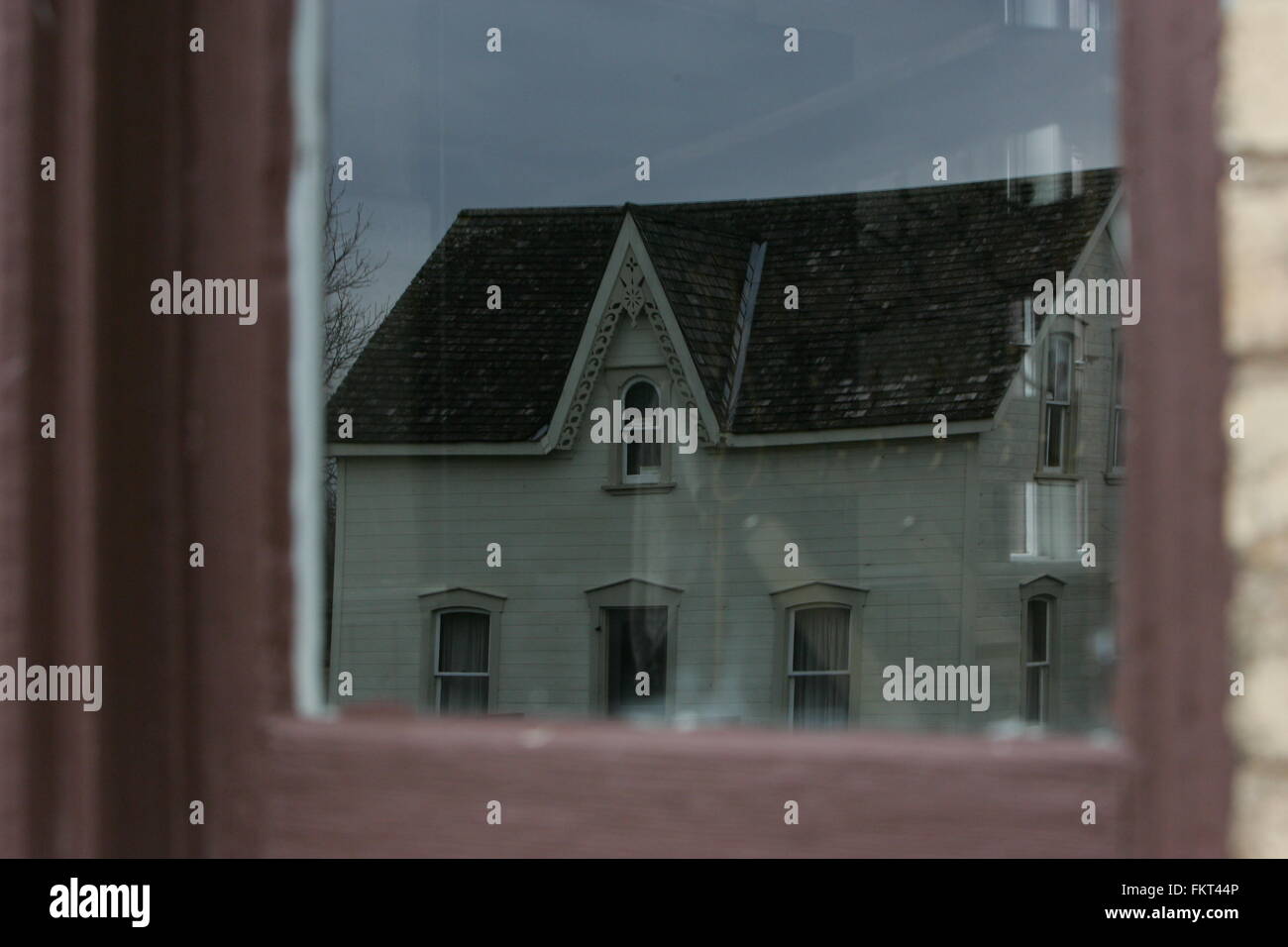 Old creepy house in reflection through window Stock Photo - Alamy