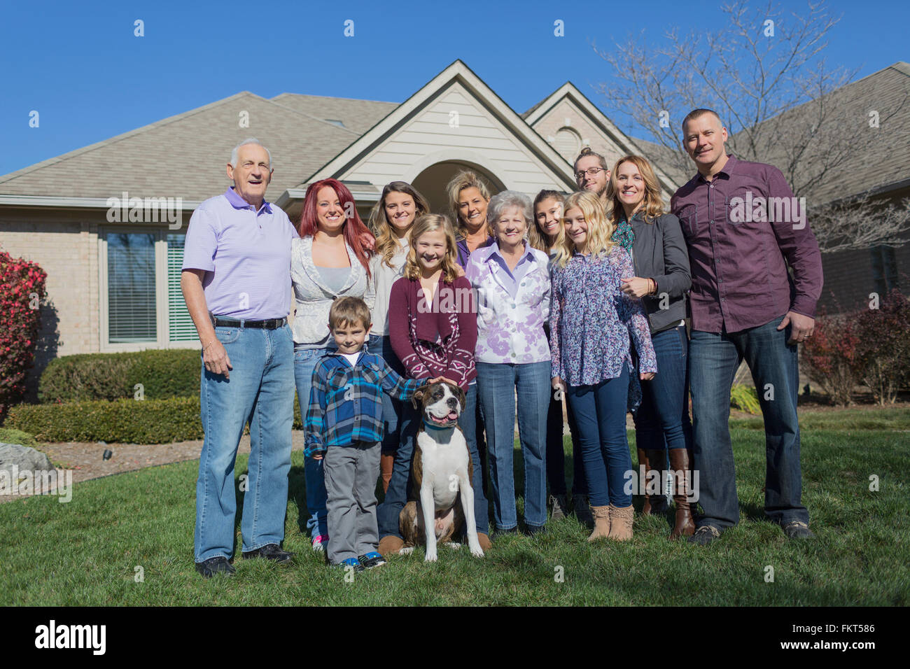 Caucasian multi-generation family smiling in yard Stock Photo - Alamy
