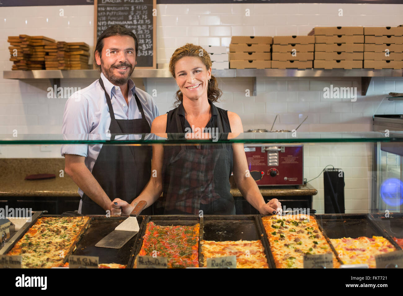 Caucasian servers smiling in cafe Stock Photo - Alamy
