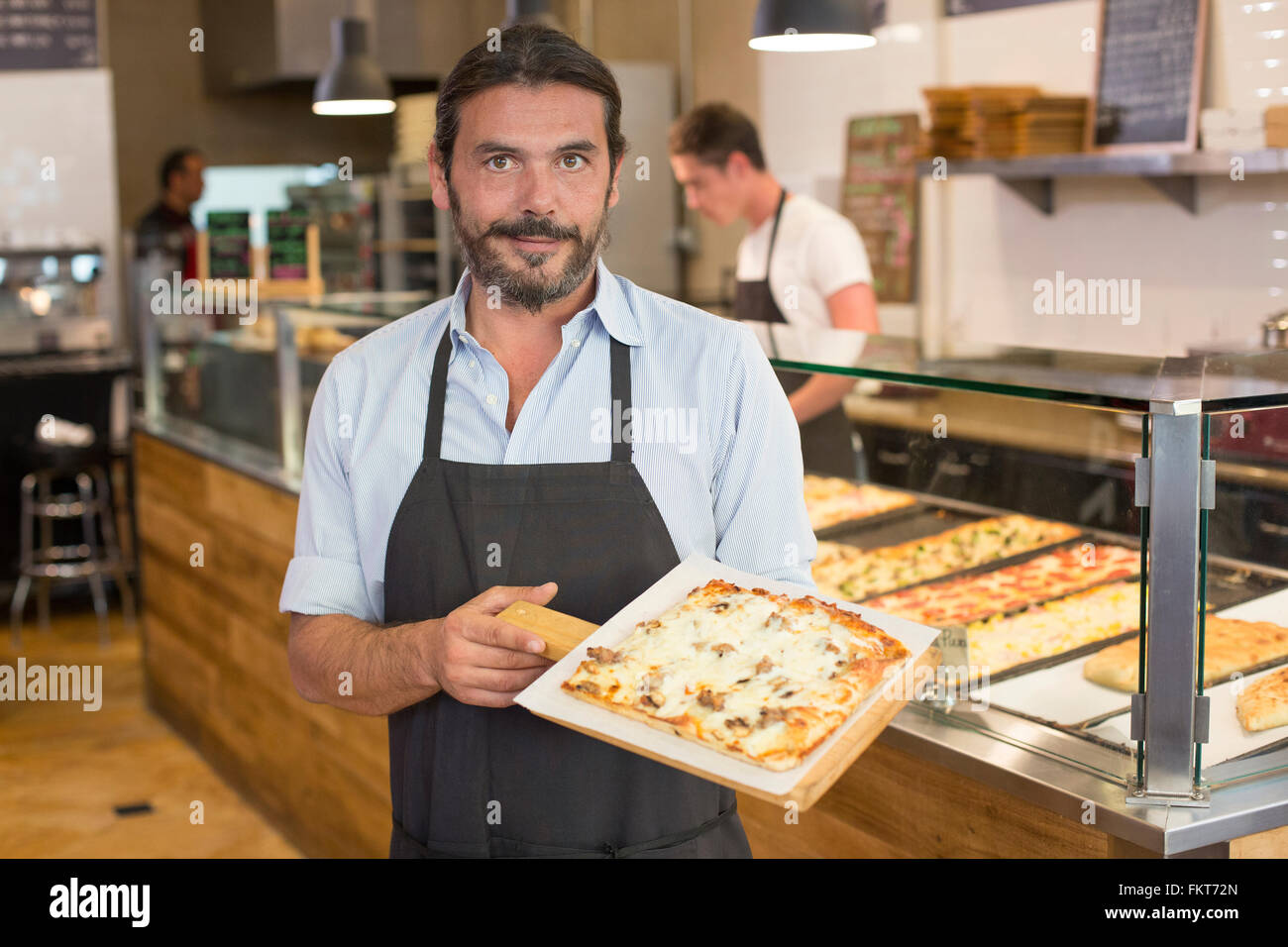 Man eating pizza in bar hi-res stock photography and images - Alamy