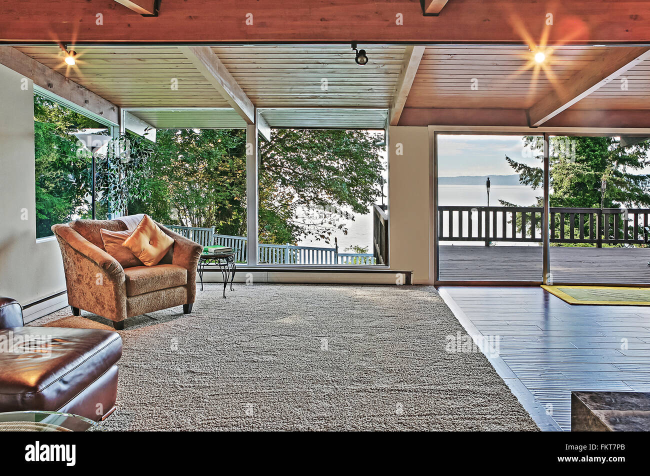 Window with lake view in living room Stock Photo - Alamy