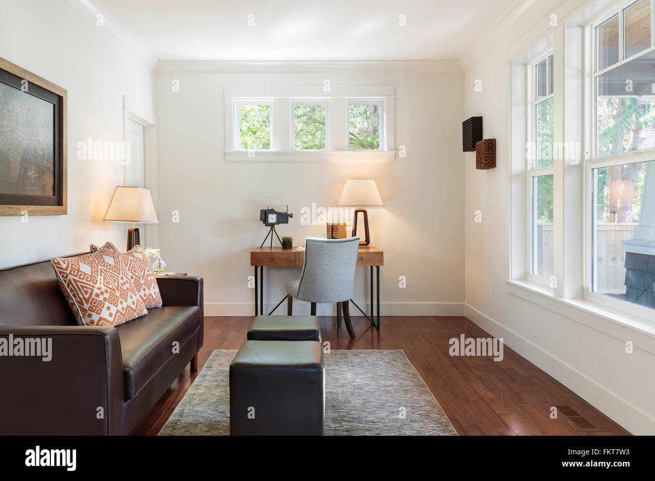 Sofa and desk in living room Stock Photo - Alamy