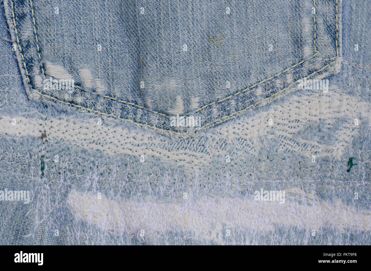 blue faded ripped jeans ,close up Stock Photo - Alamy