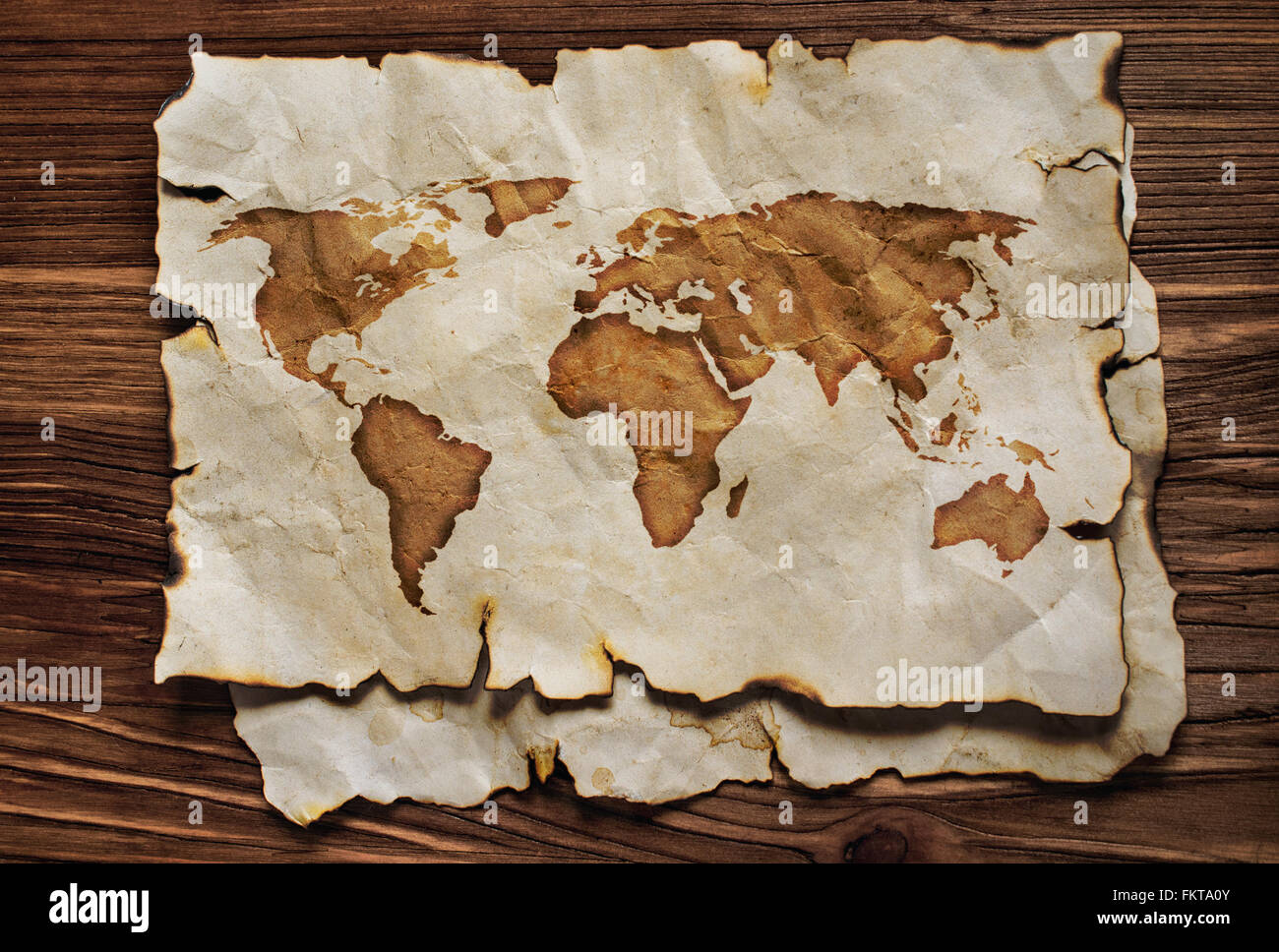Old map on parchment on the wooden background Stock Photo - Alamy
