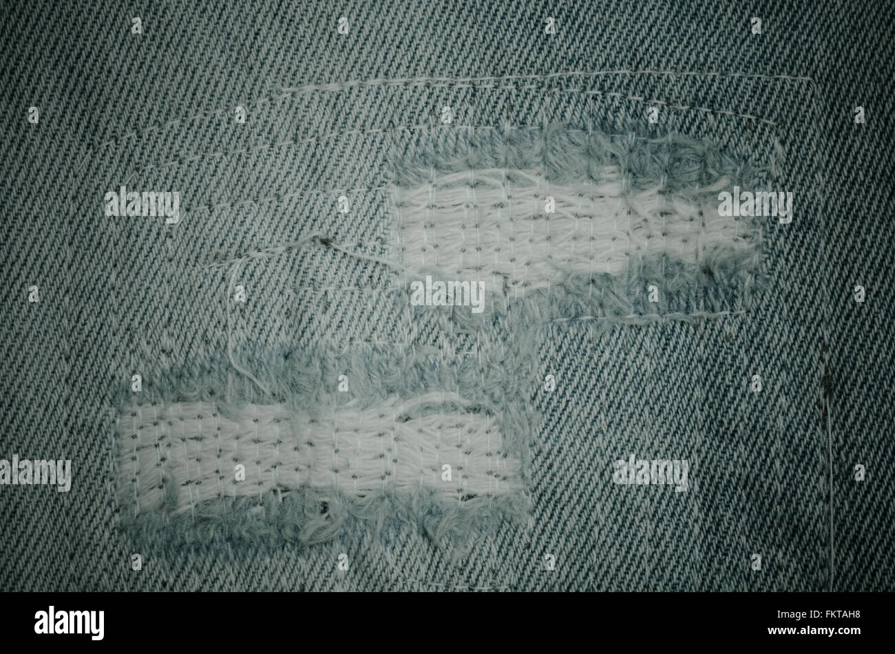 blue faded ripped jeans, close up Stock Photo - Alamy