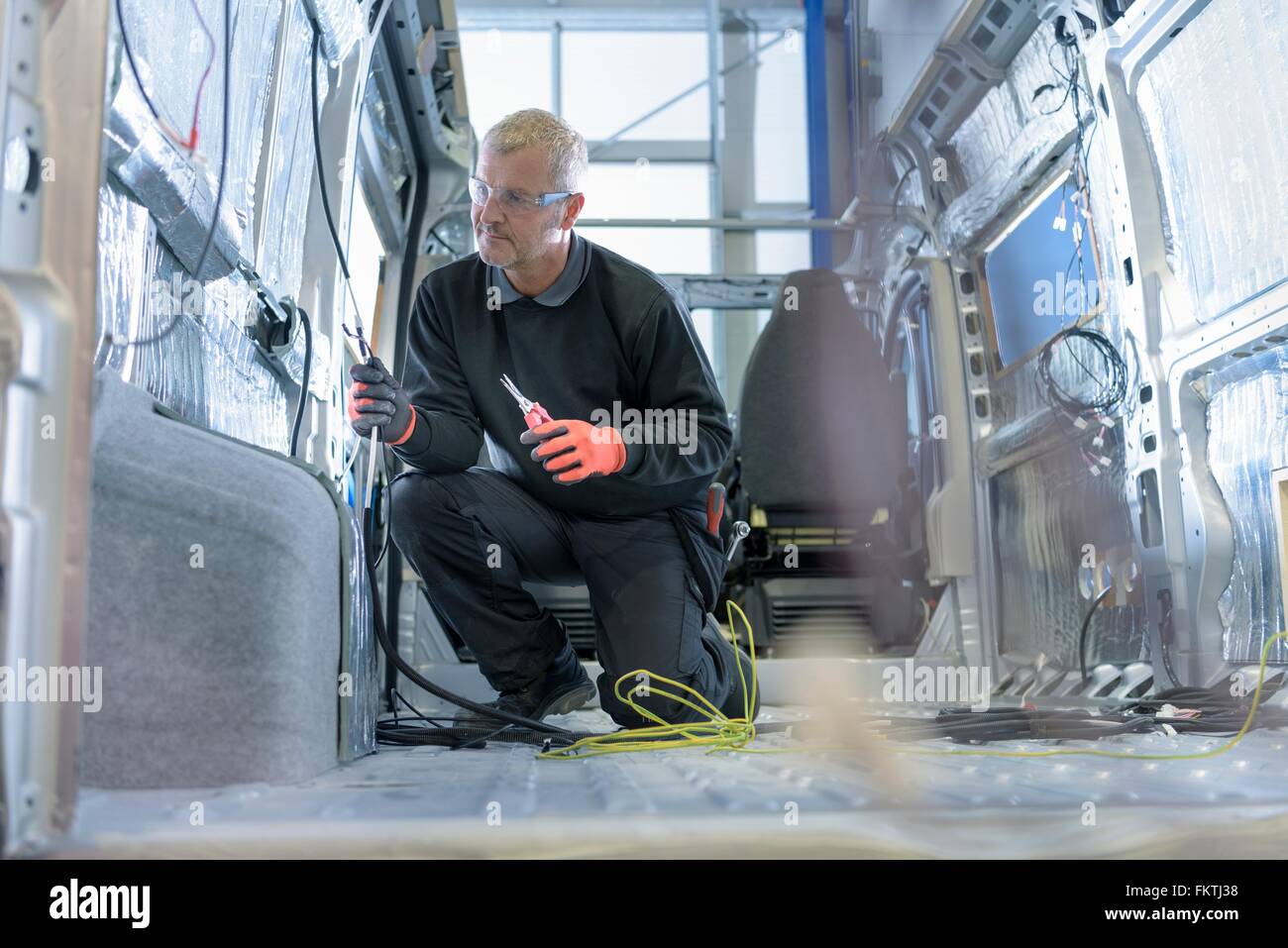 Production line worker hi-res stock photography and images - Alamy