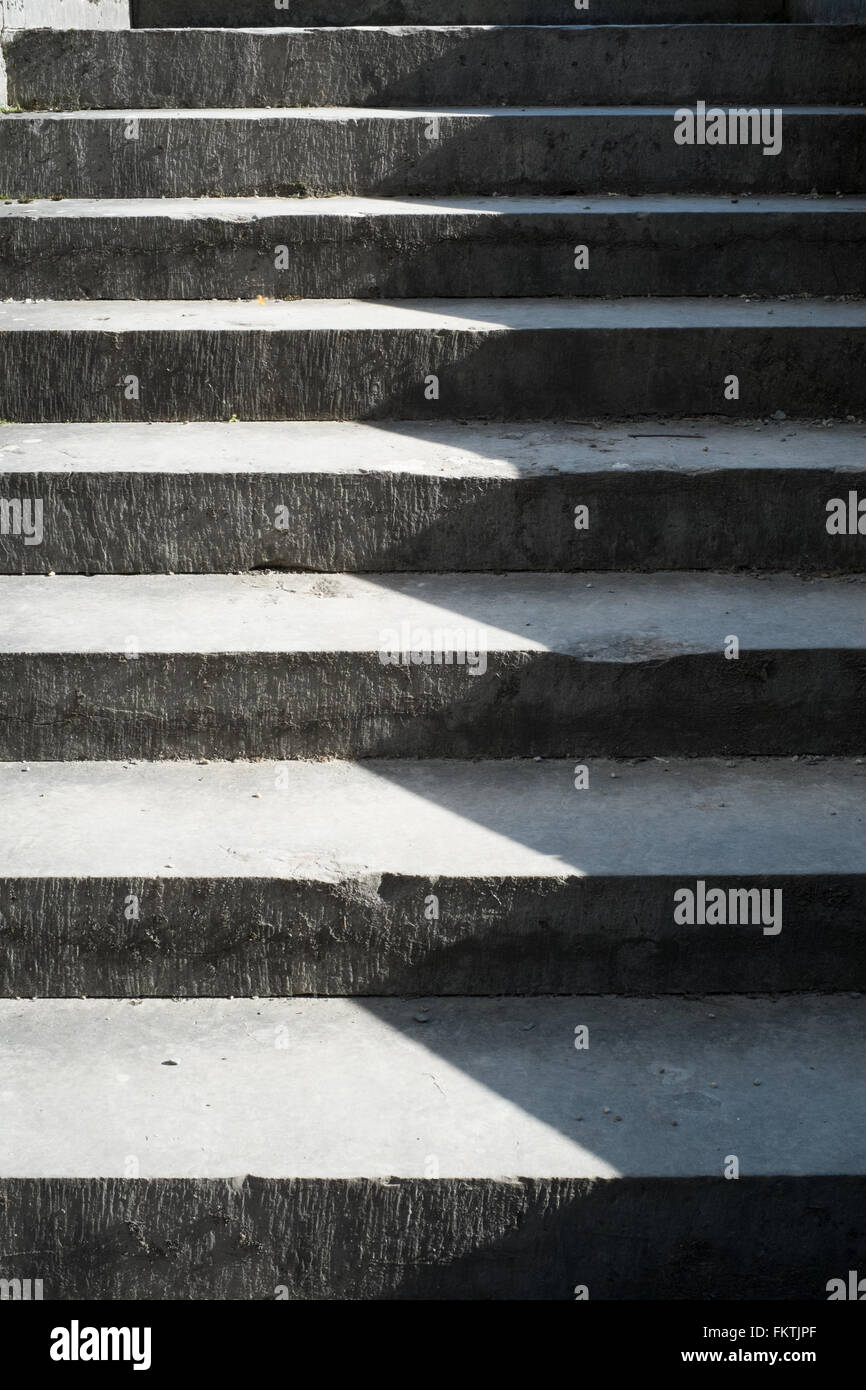 Grey granite exterior steps with shadows Stock Photo - Alamy