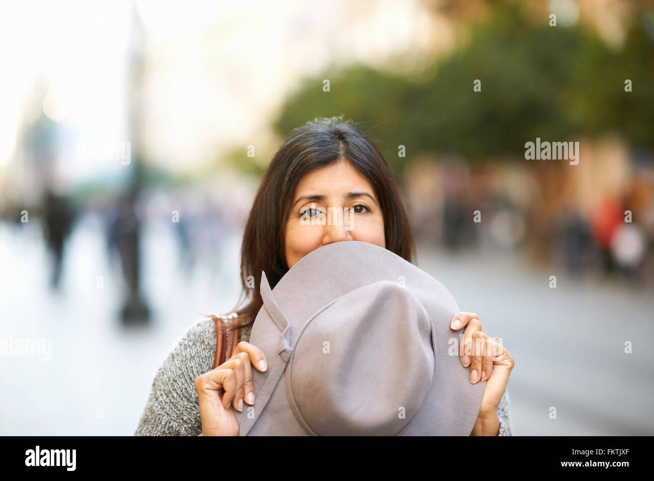 Person on street holding hi-res stock photography and images - Alamy