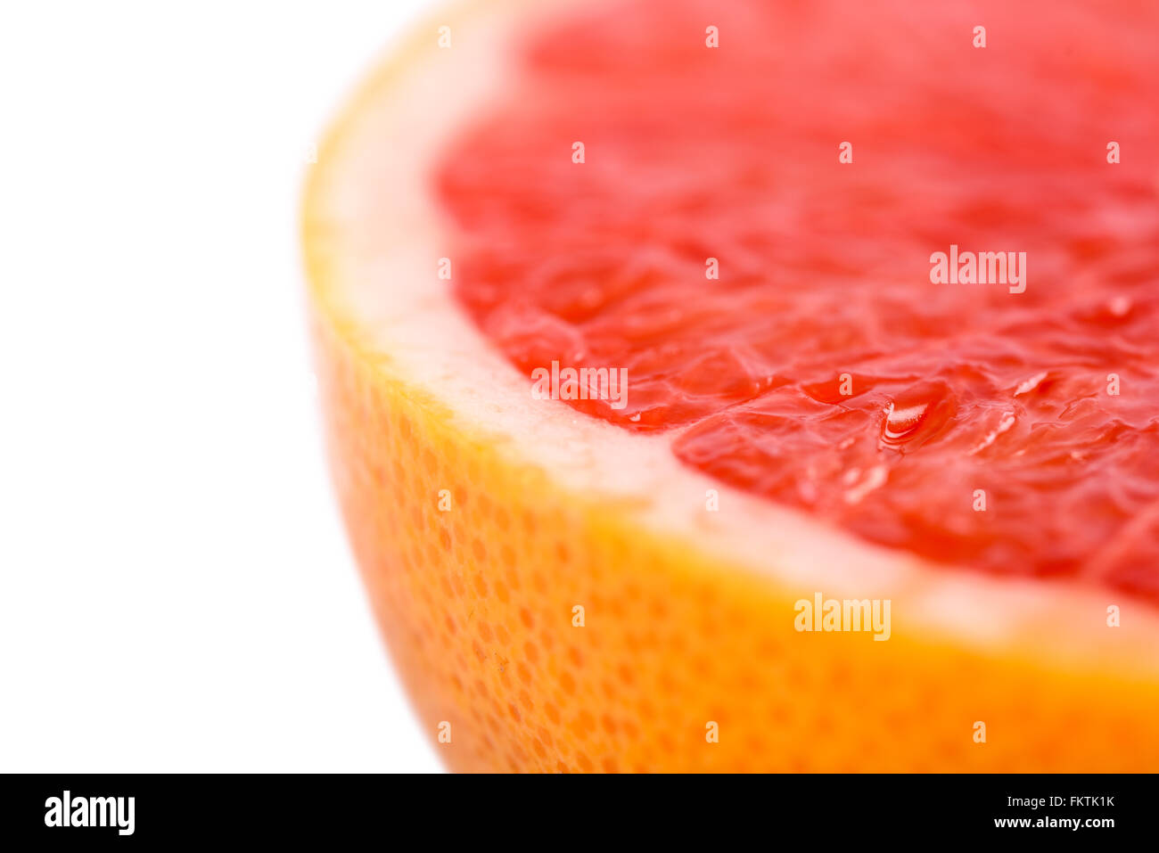 Fresh Red Grapefruit Slice Closeup Stock Photo - Alamy