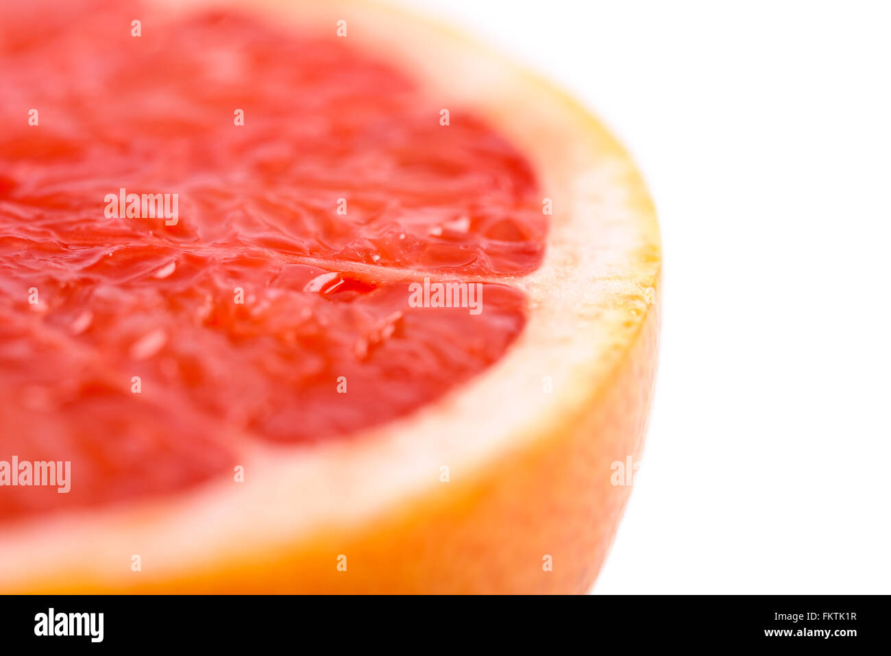 Fresh Red Grapefruit Slice Closeup Stock Photo - Alamy