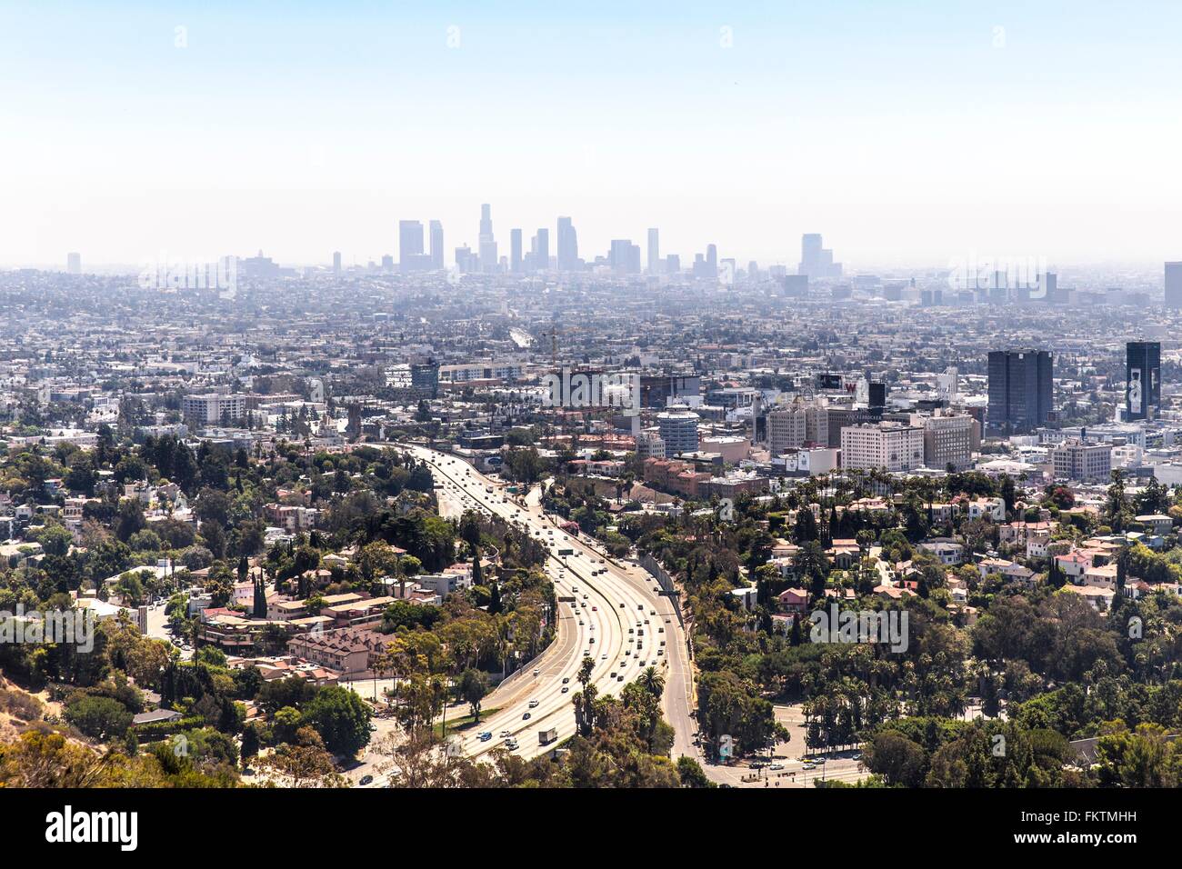 Elevated view of highway curving through urban sprawl, Los Angeles ...