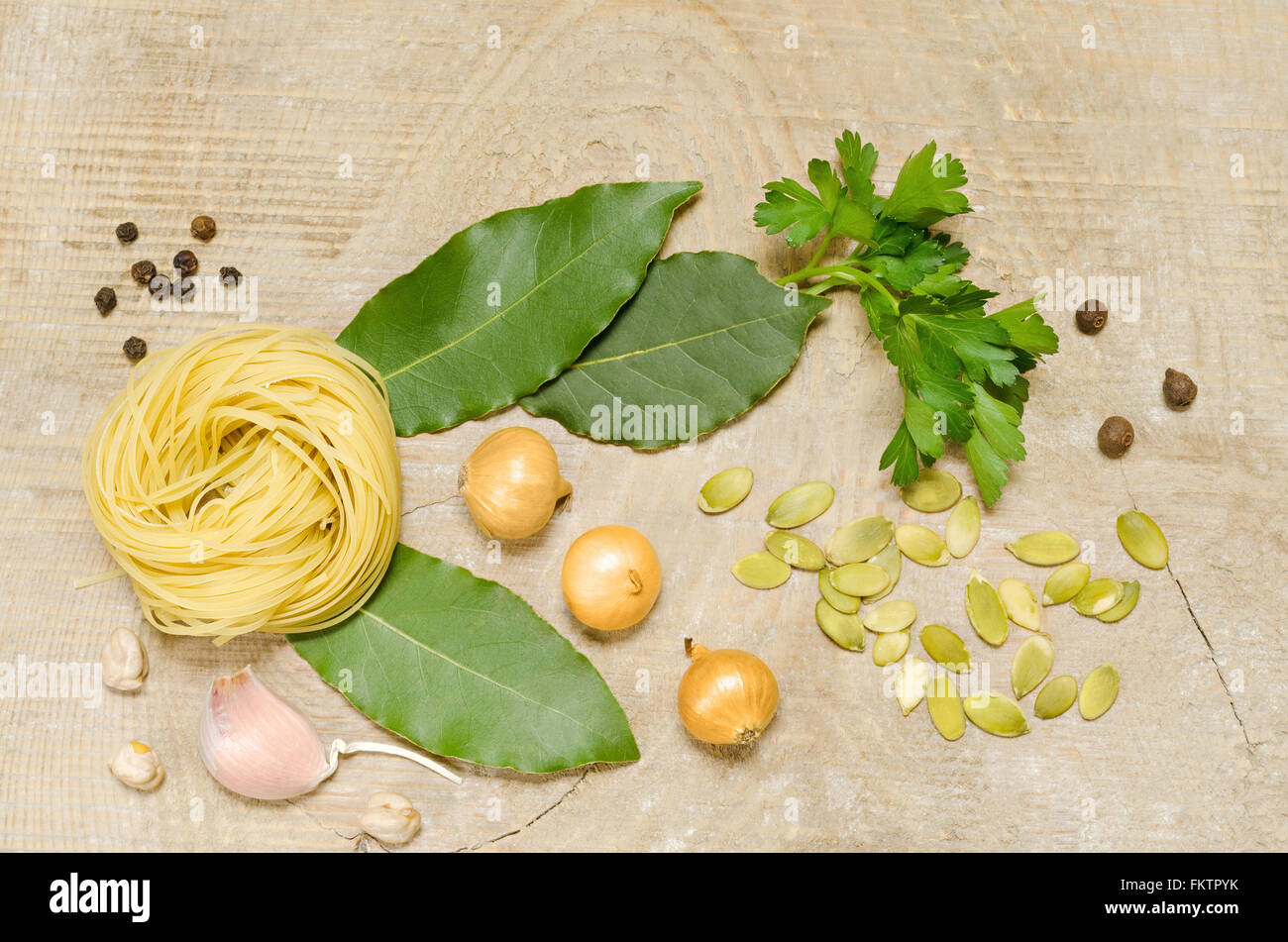 Not cooked pasta and spices lying on the old Board Stock Photo - Alamy