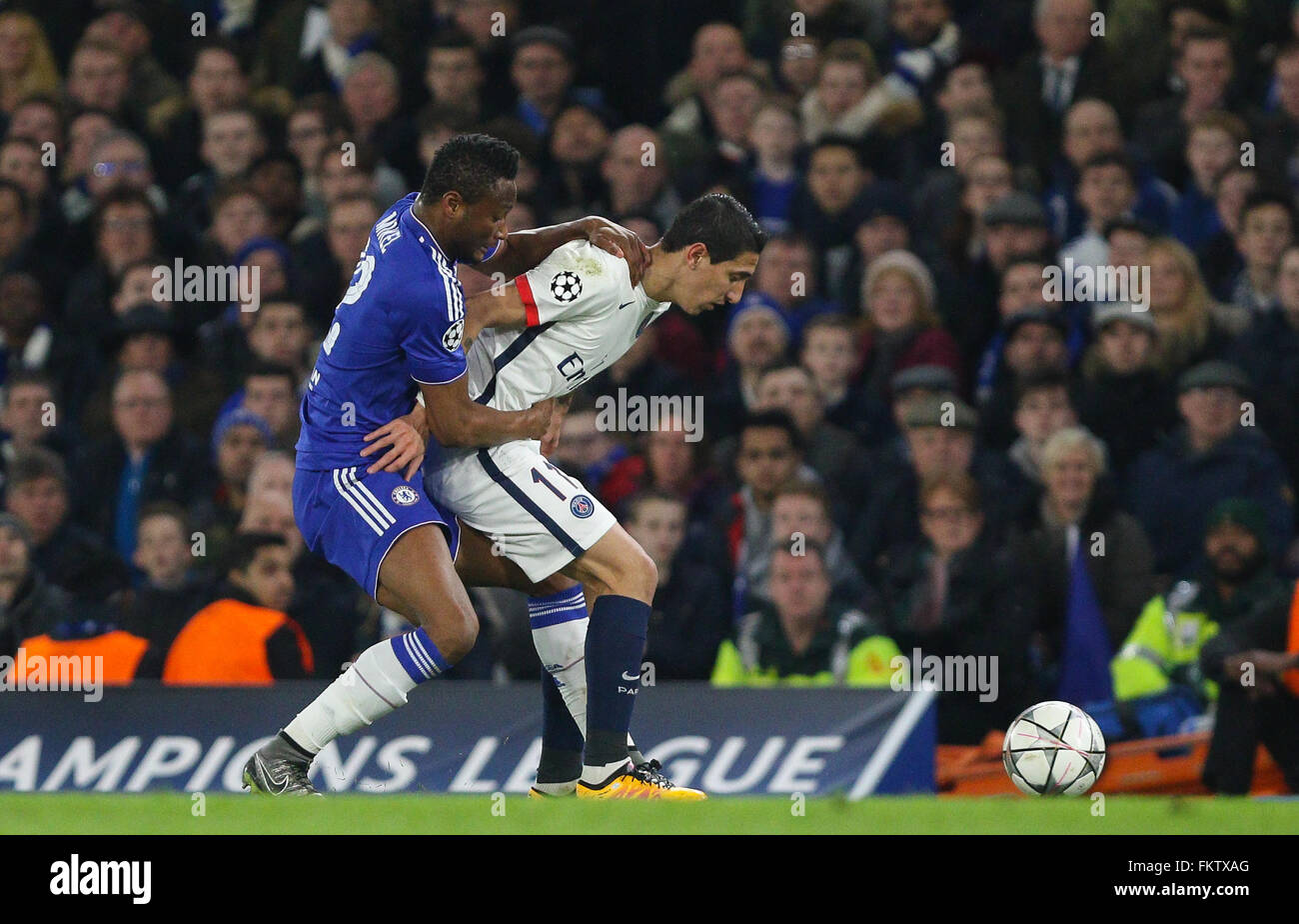 Angel Di Maria of Paris Saint-Germain (white) holds off a challenge ...