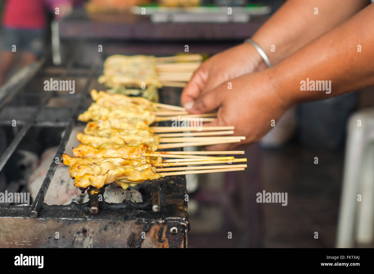 Pork satay grilled on stove Stock Photo - Alamy
