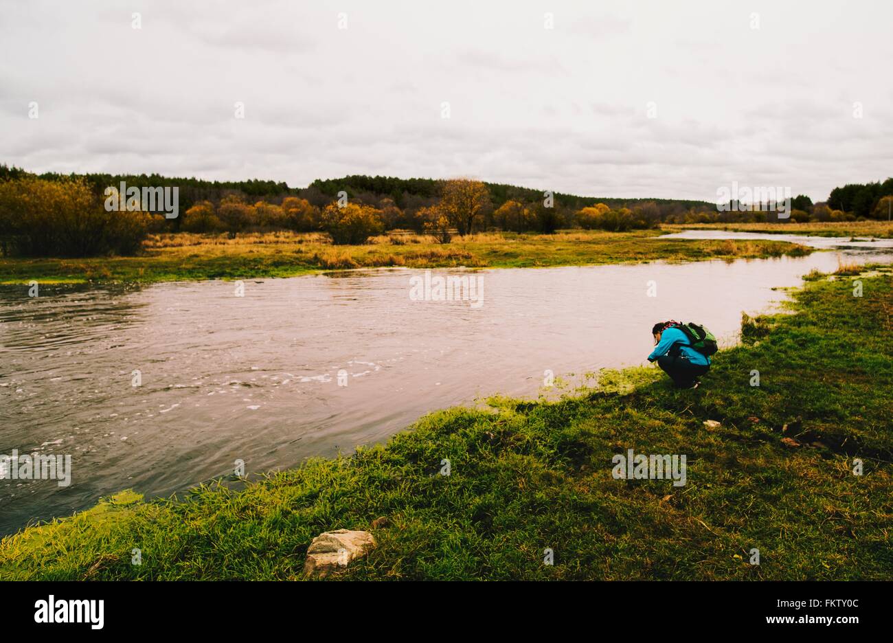 Crouching beside river hi-res stock photography and images - Alamy