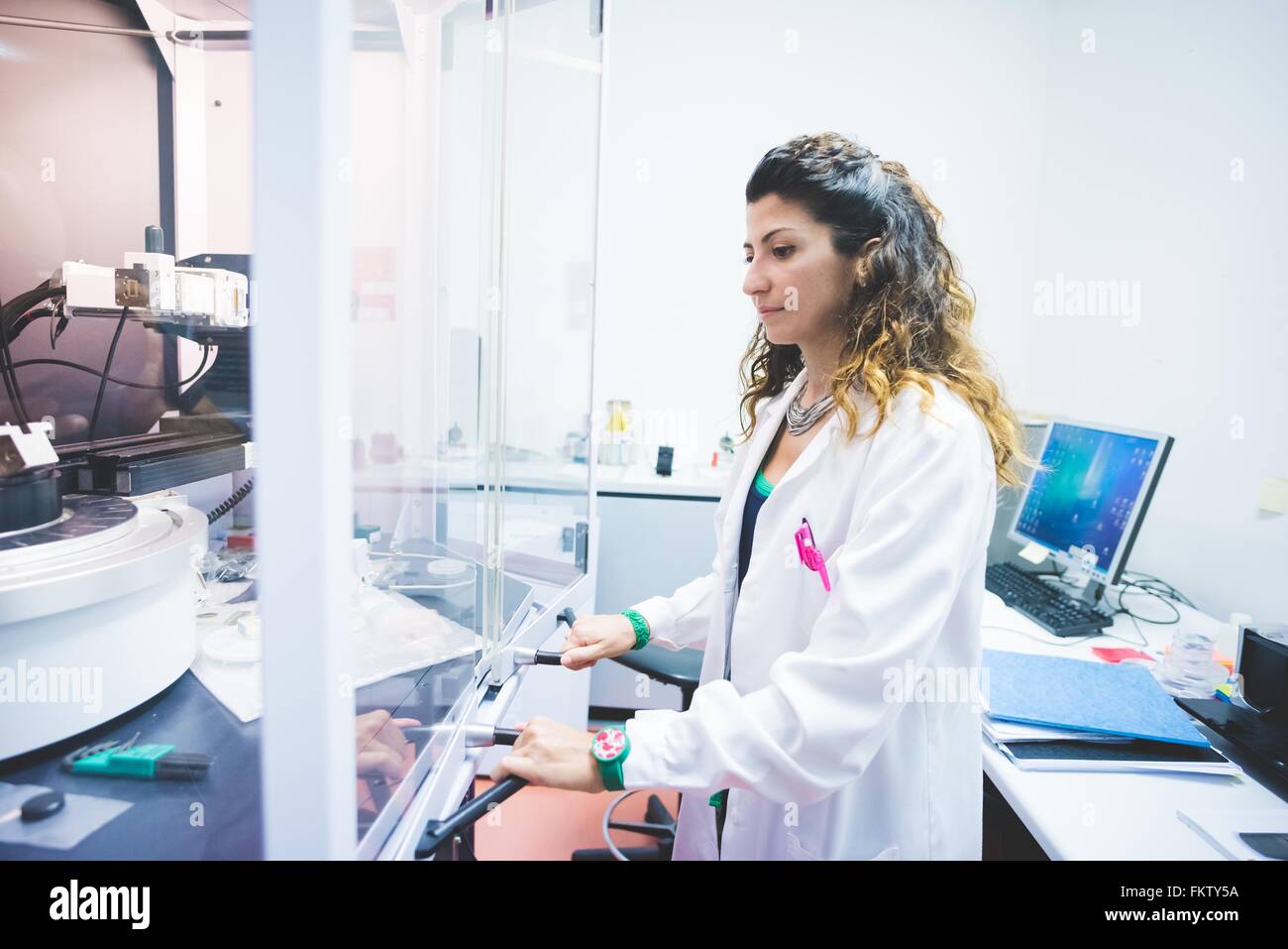 Female scientist opening x-ray diffractometer Stock Photo - Alamy