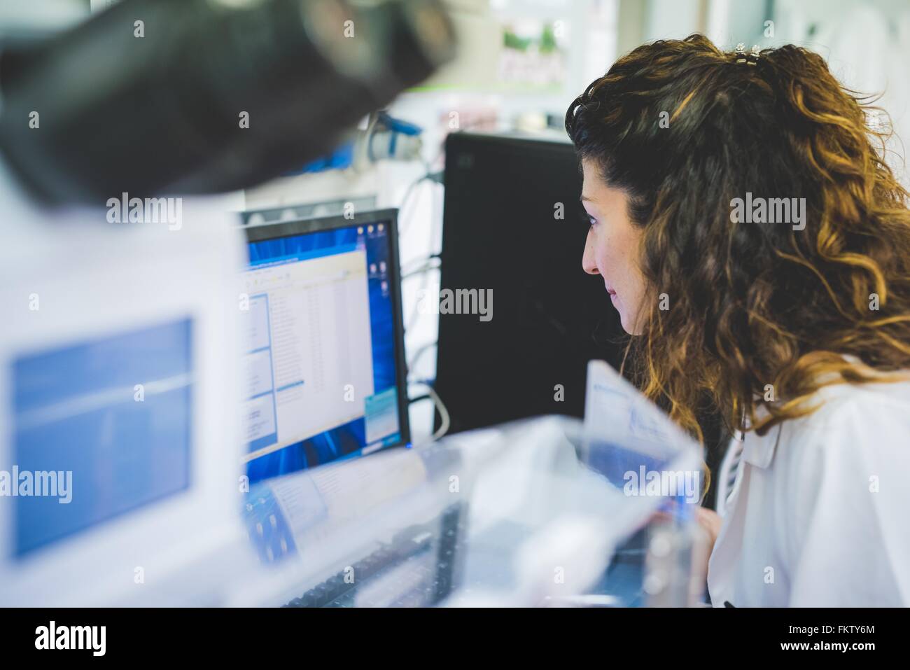 Female scientist using FTIR spectrophotometer, analyzing FTIR map Stock ...